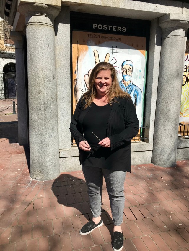 Kim-Briscoe-of-Kimprints-in-front-of-mural-April-2020. | angelvancouver